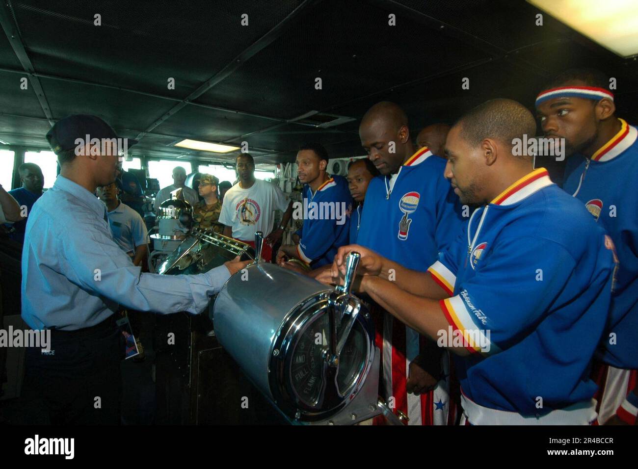 US Navy briefs members of the Harlem Globetrotters basketball team on ...