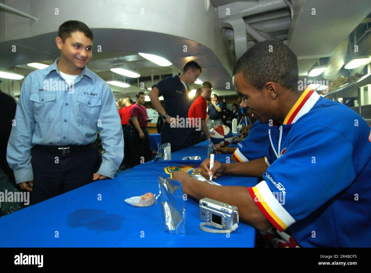 US Navy Sailors assigned to USS Kitty Hawk (CV 63) take advantage of an ...