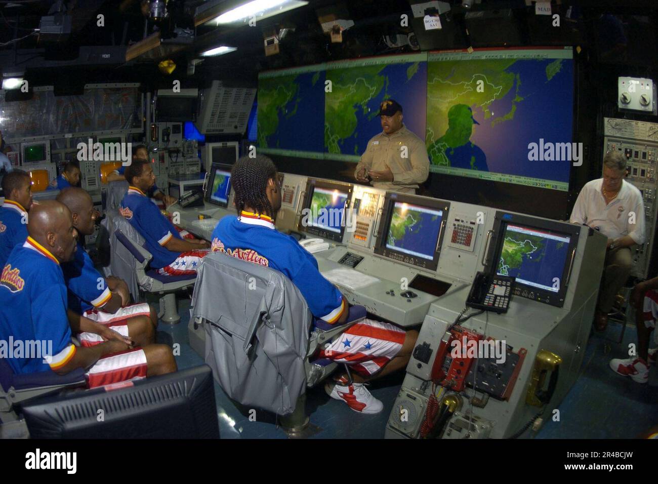 US Navy The Harlem Globetrotters receive a brief during a tour of the ...