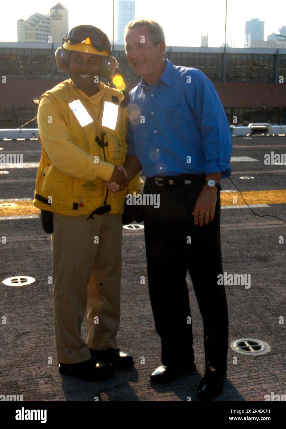 US Navy President George W. Bush pauses to take a photo with U.S. Navy ...