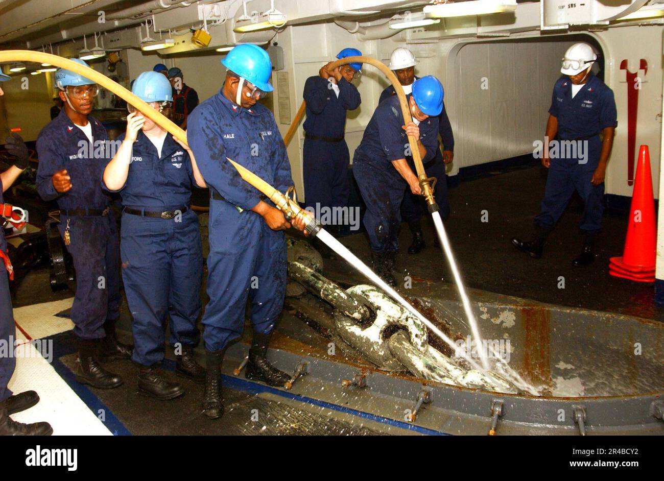 US Navy Boatswain's Mates assigned to Deck Department spray mud and ...