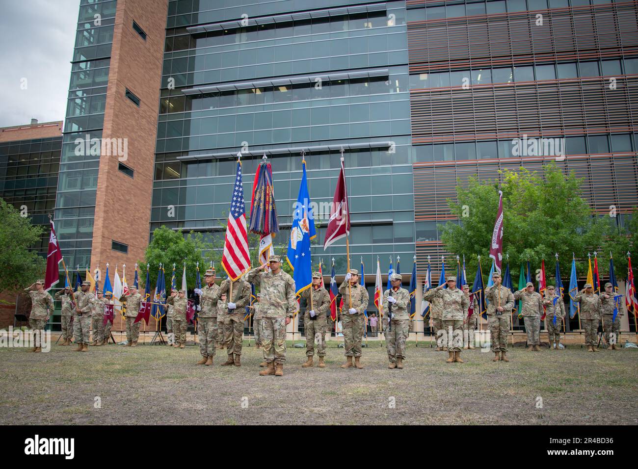 Enlisted Soldiers present arms before the official party at a change of ...