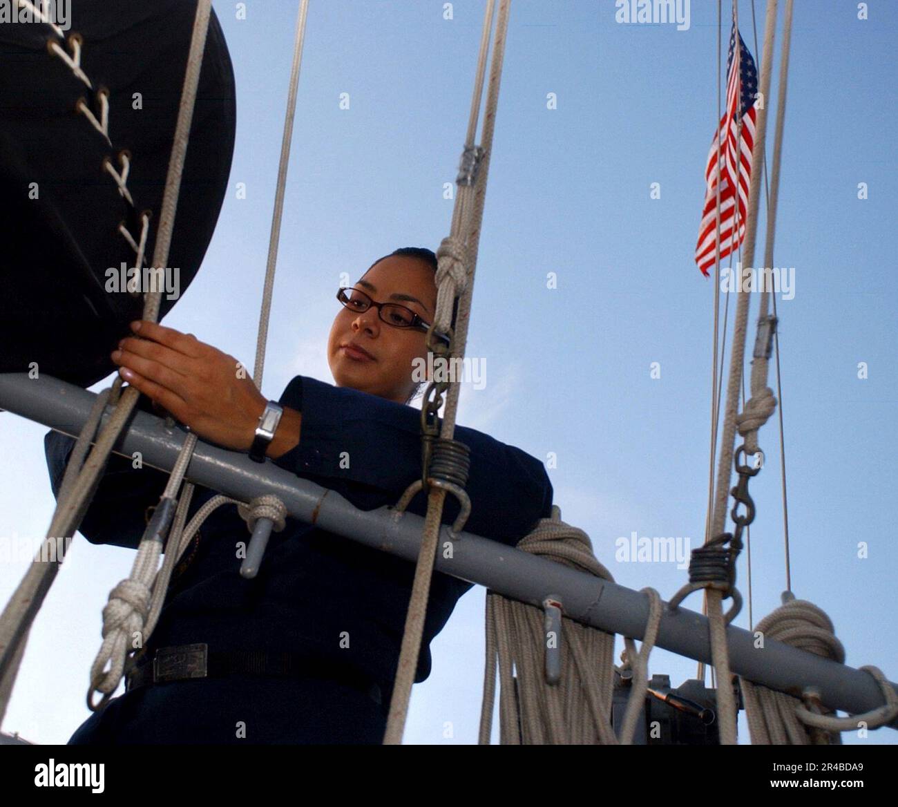 US Navy Quartermaster 2nd Class prepares to fly a ball day shape to ...
