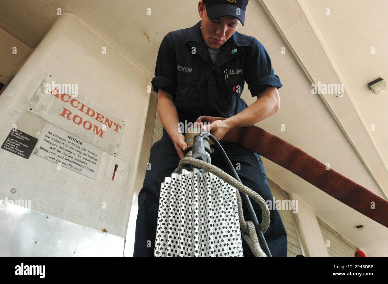 US Navy Damage Controlman Fireman assigned to the amphibious assault ...