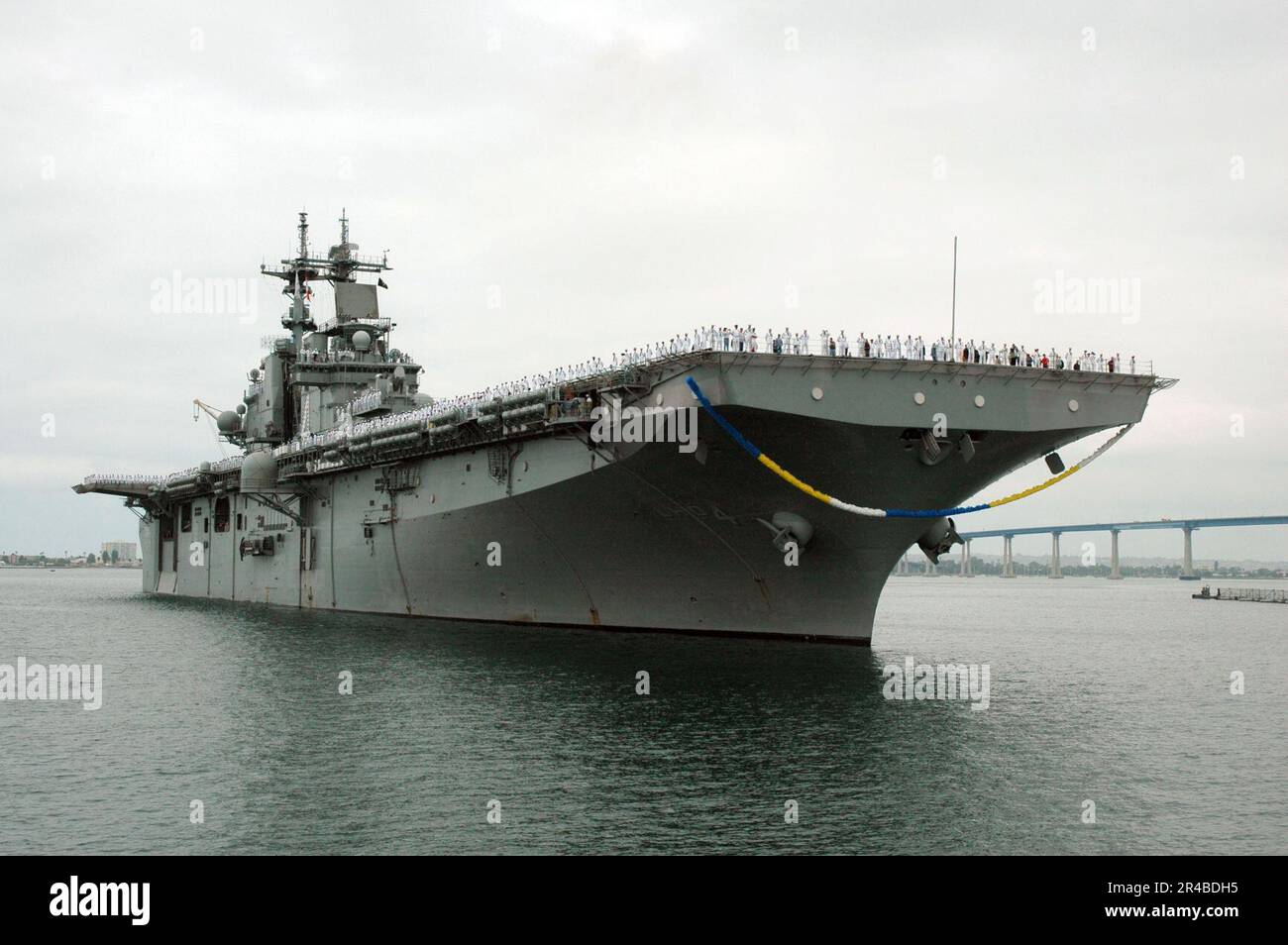 US Navy Crew members assigned to the multi-purpose amphibious assault ...