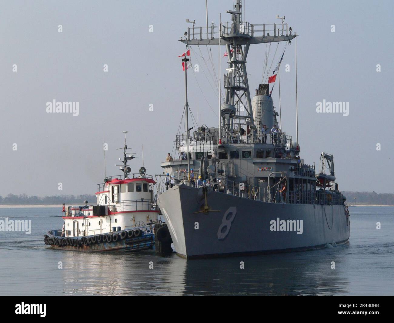US Navy The minesweeper USS Scout (MCM 8) is assisted by a tugboat as ...