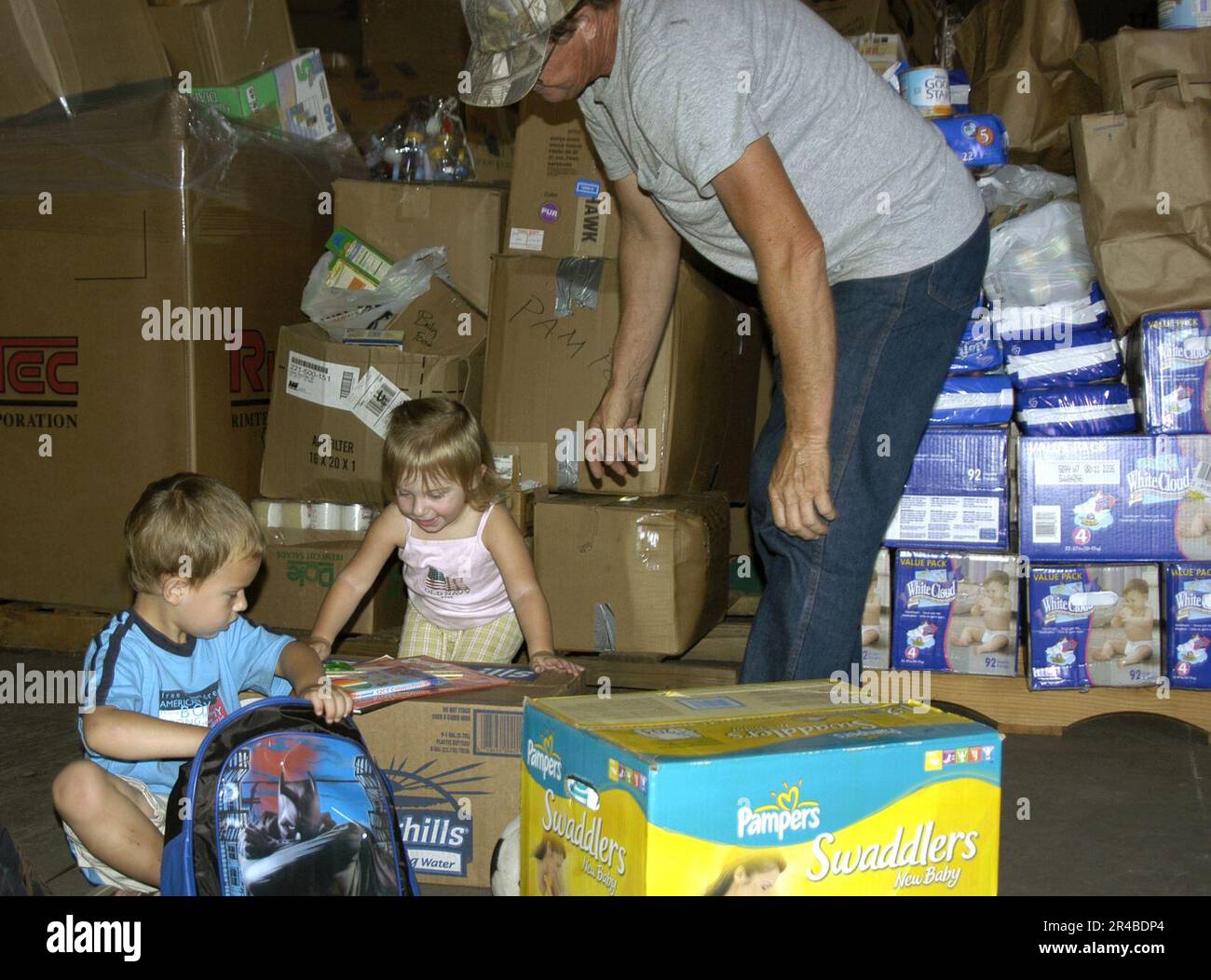 US Navy A local family stops by a Salvation Army warehouse managed by ...