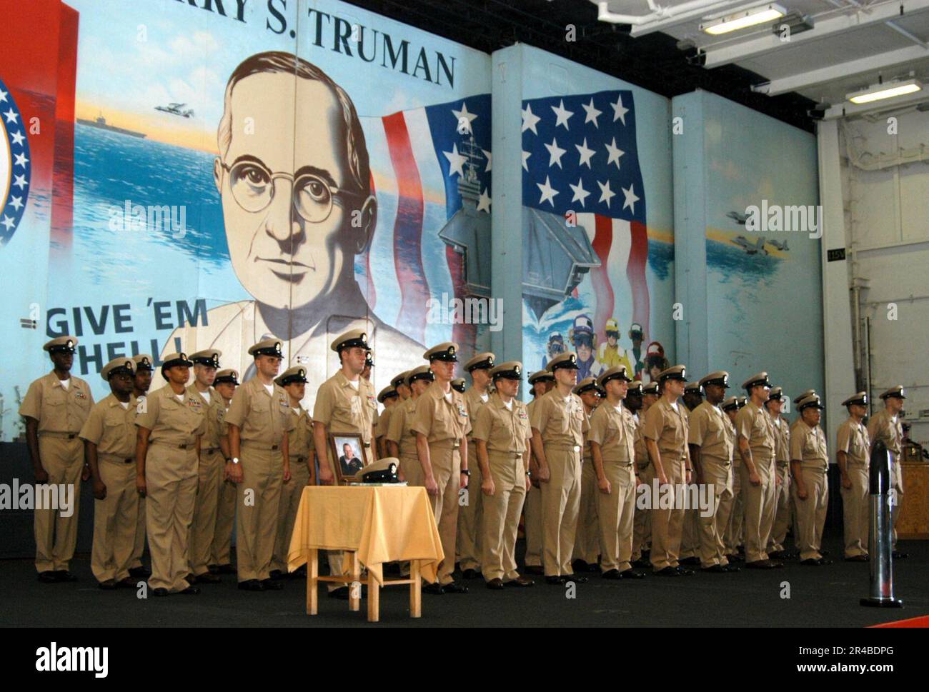US Navy Newly pinned chief petty officers (CPOs) stand in formation ...