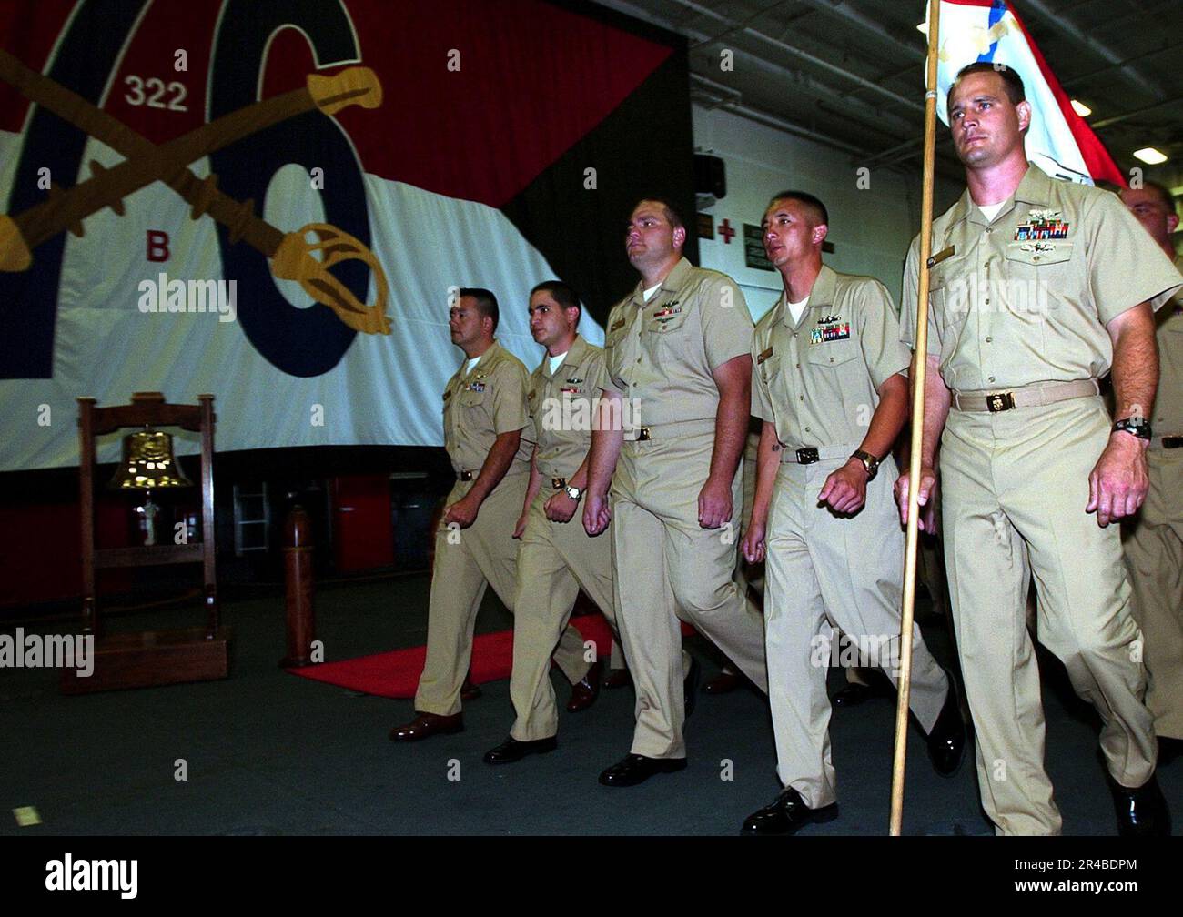 US Navy Newly selected chief petty officers march across the hangar bay ...