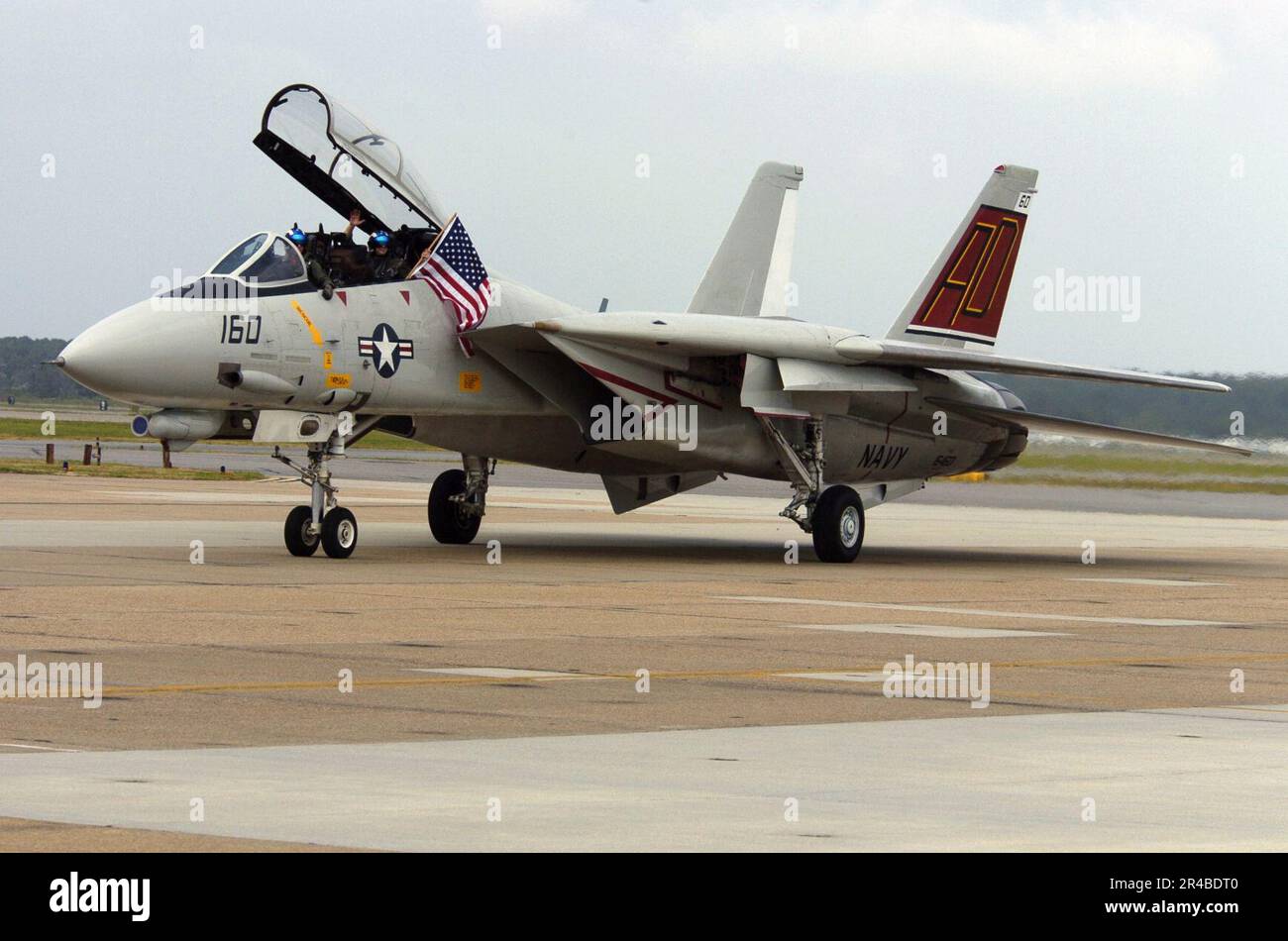 US Navy Air crewmen wave from their F-14D Tomcat as they taxi at the ...