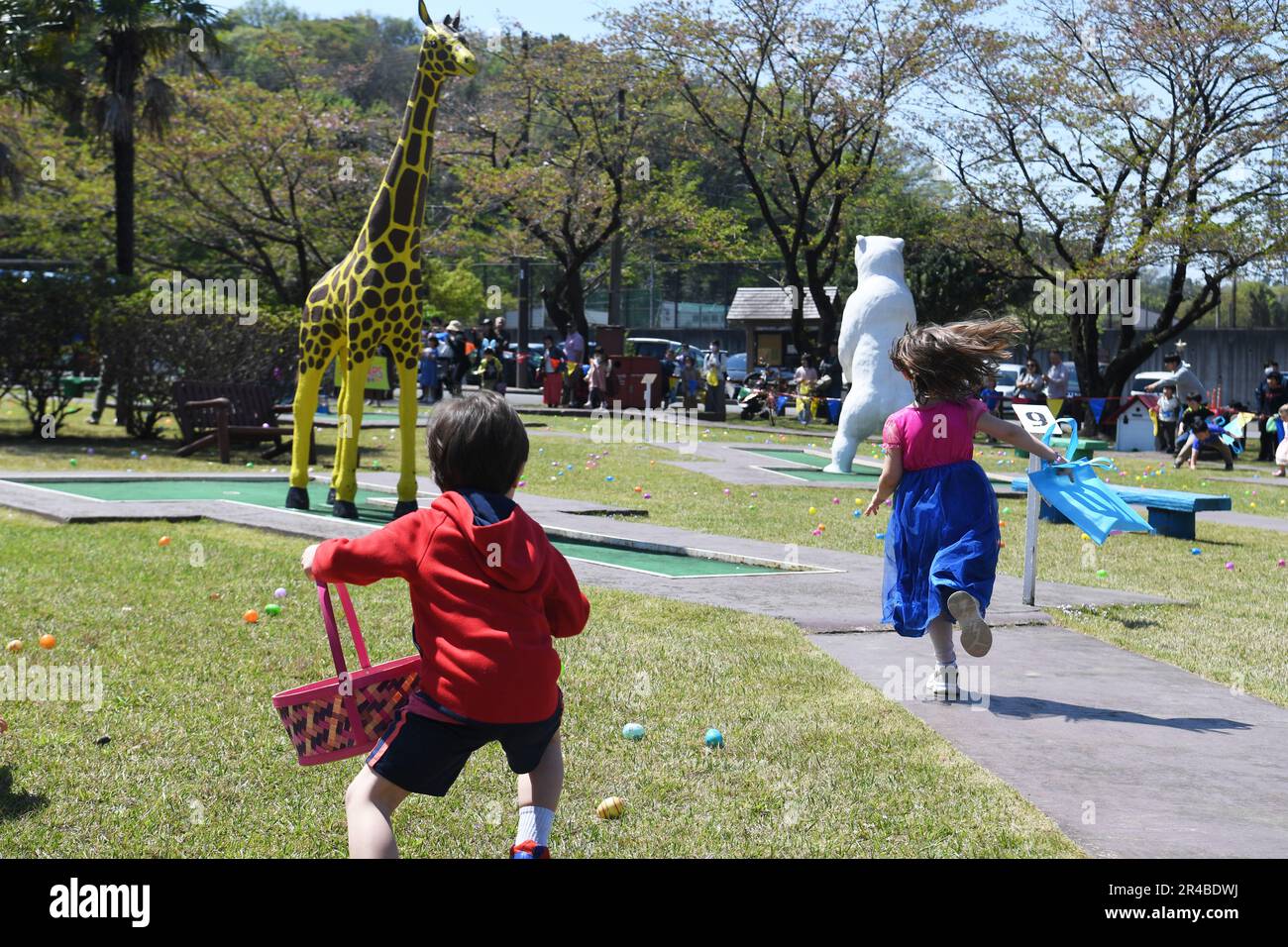Children of Team Yokota rush the Tama Hills Recreation Area mini-golf ...