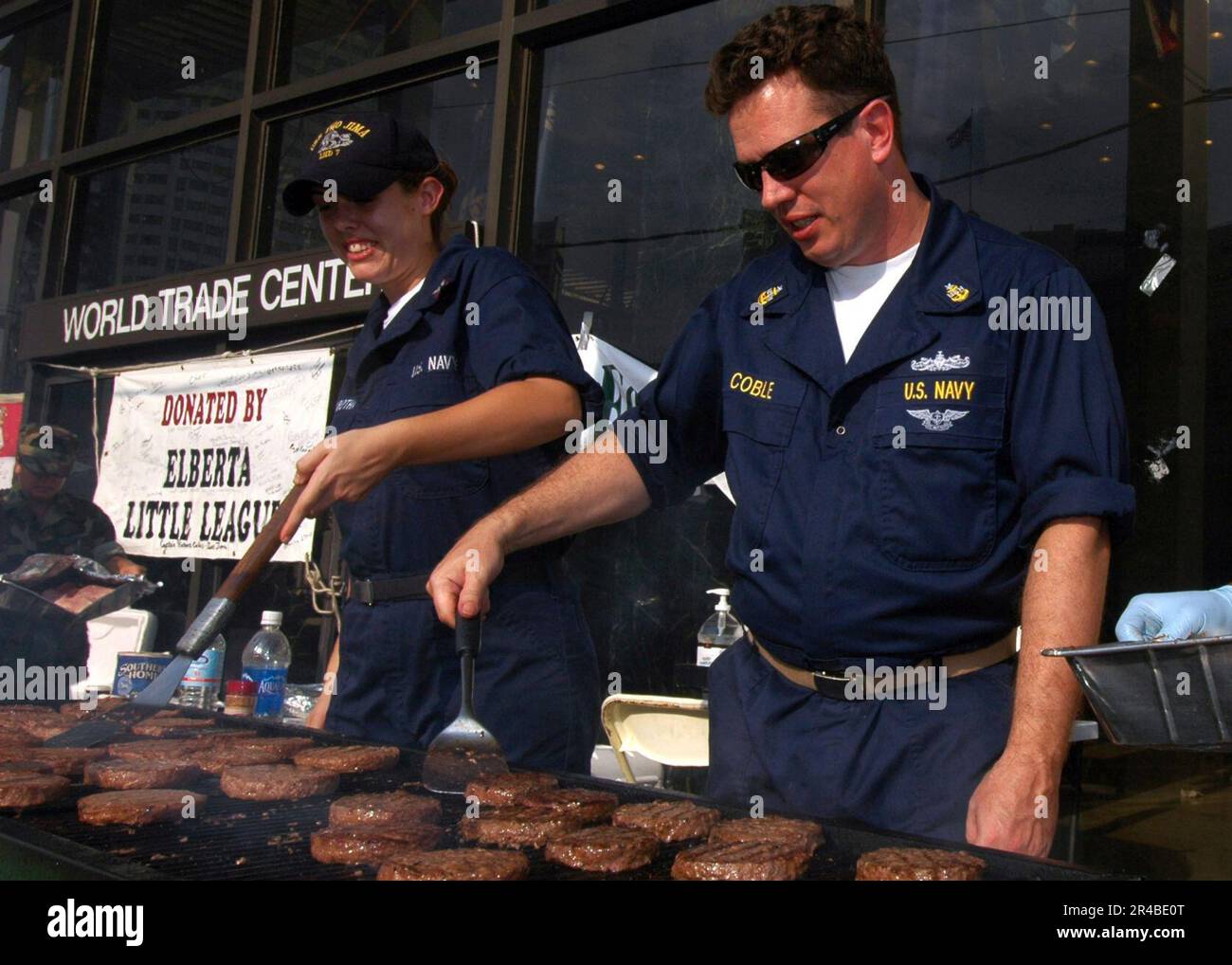 US Navy Crew members assigned aboard the amphibious assault ship USS ...