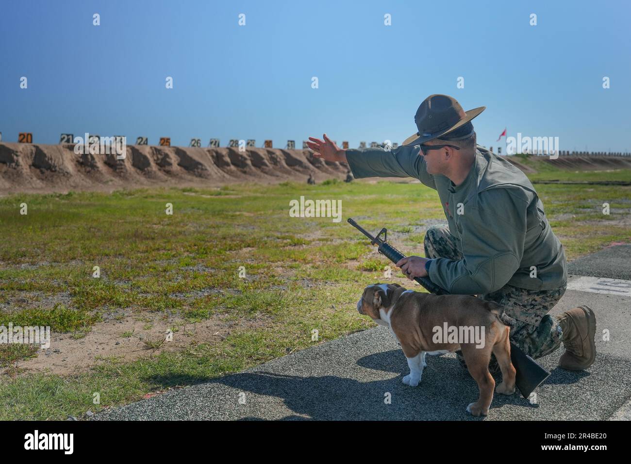 U.S. Marine Corps. Rct. Bruno pays attention as the range coach ...