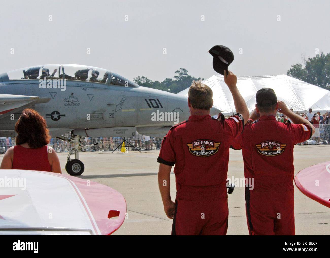 US Navy Members of the Red Baron Squadron give a final salute to the F ...