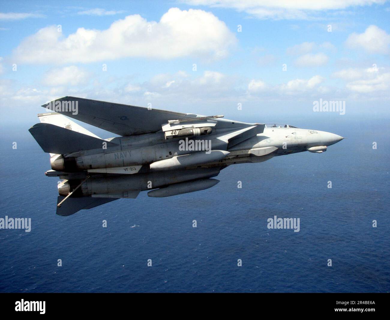 US Navy An F-14D Tomcat banks with its tailhook lowered in preparation ...