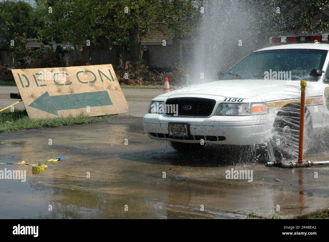 US Navy New Orleans Police Department patrol cars move through a ...