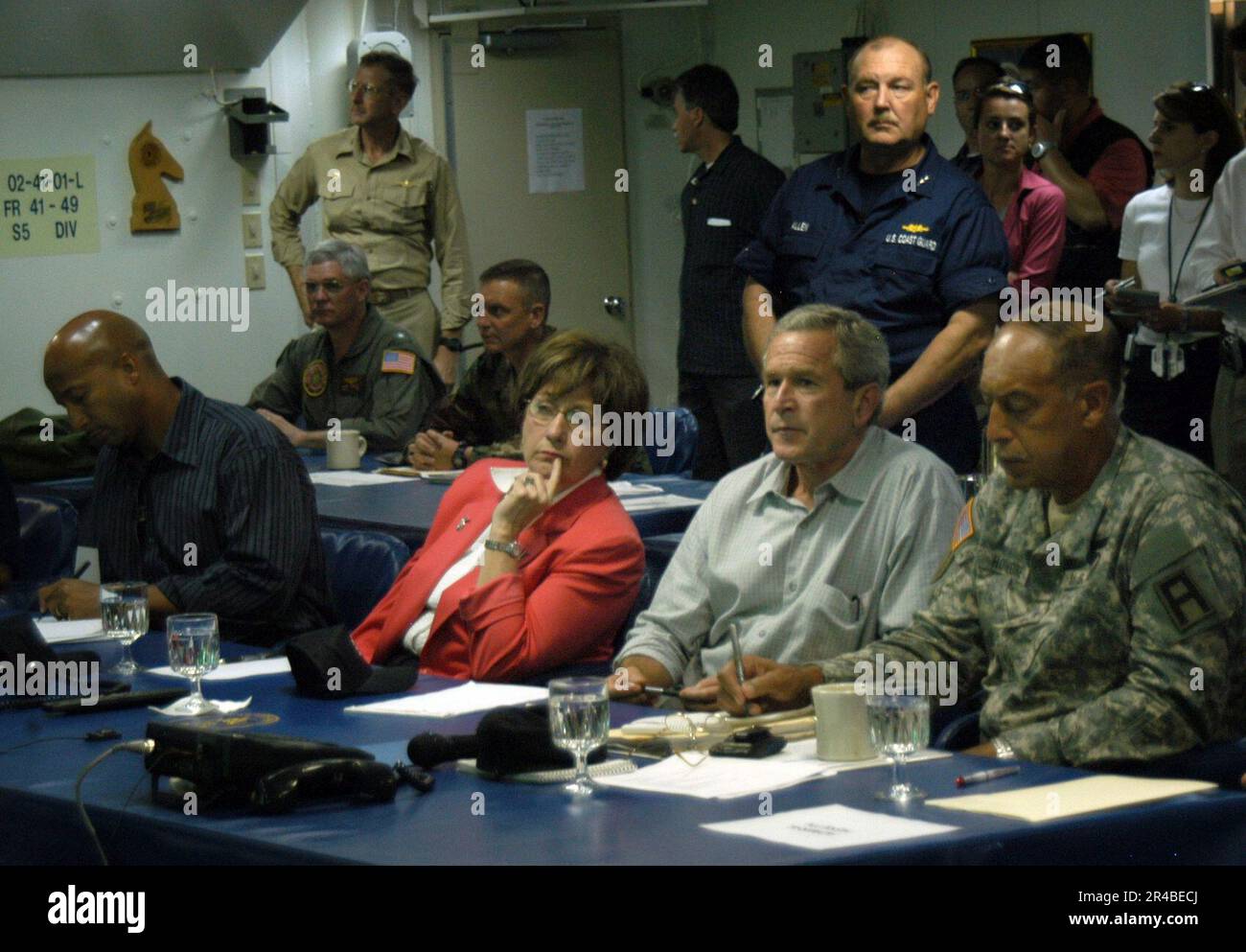 US Navy President George W. Bush receives a brief in the wardroom ...