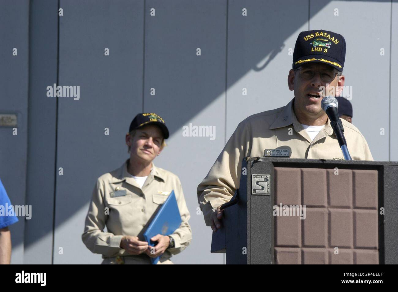 US Navy Capt. speaks to the crew of the amphibious assault ship USS ...