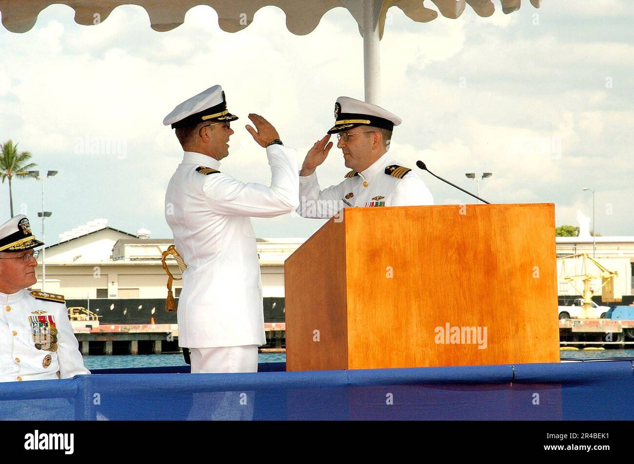 US Navy Capt. returns a hand salute rendered to him by Capt. as Tofalo ...