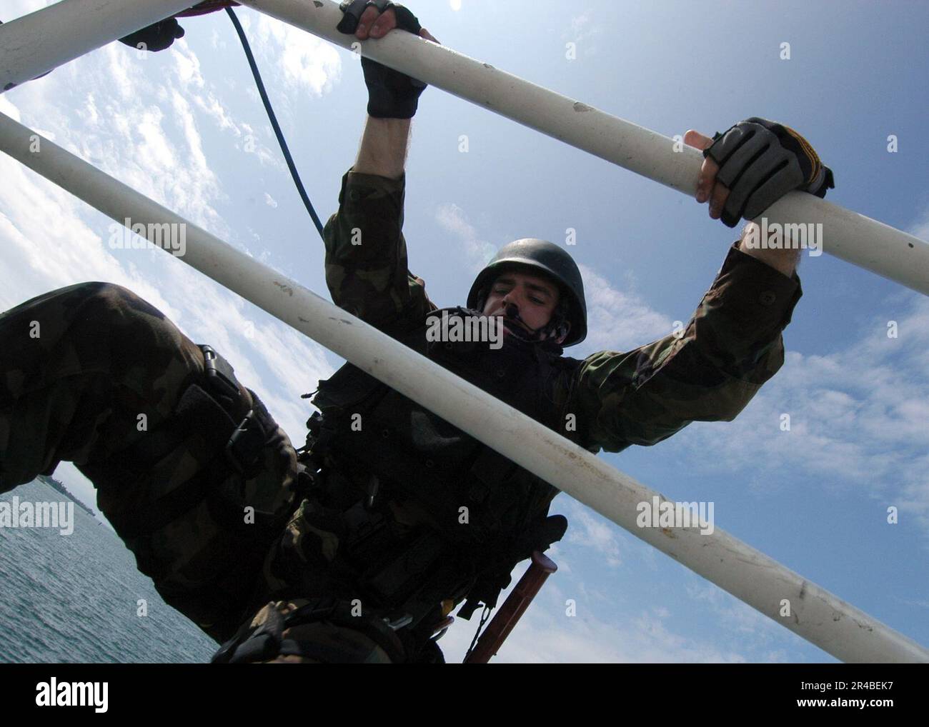 US Navy A Sailor assigned to the guided missile cruiser USS Cowpens (CG ...