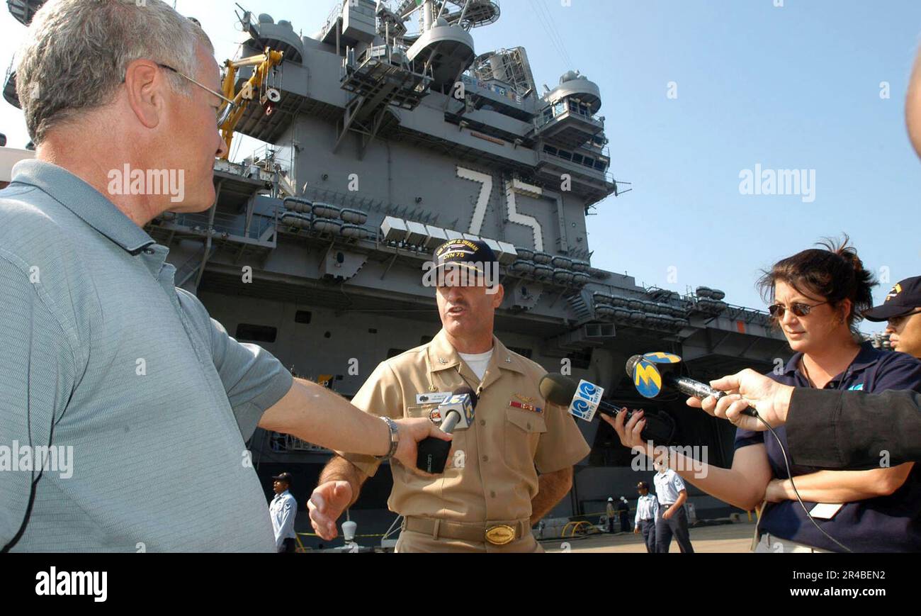 US Navy Commanding Officer, USS Harry S. Truman (CVN 75), Capt. speaks to local media after ...