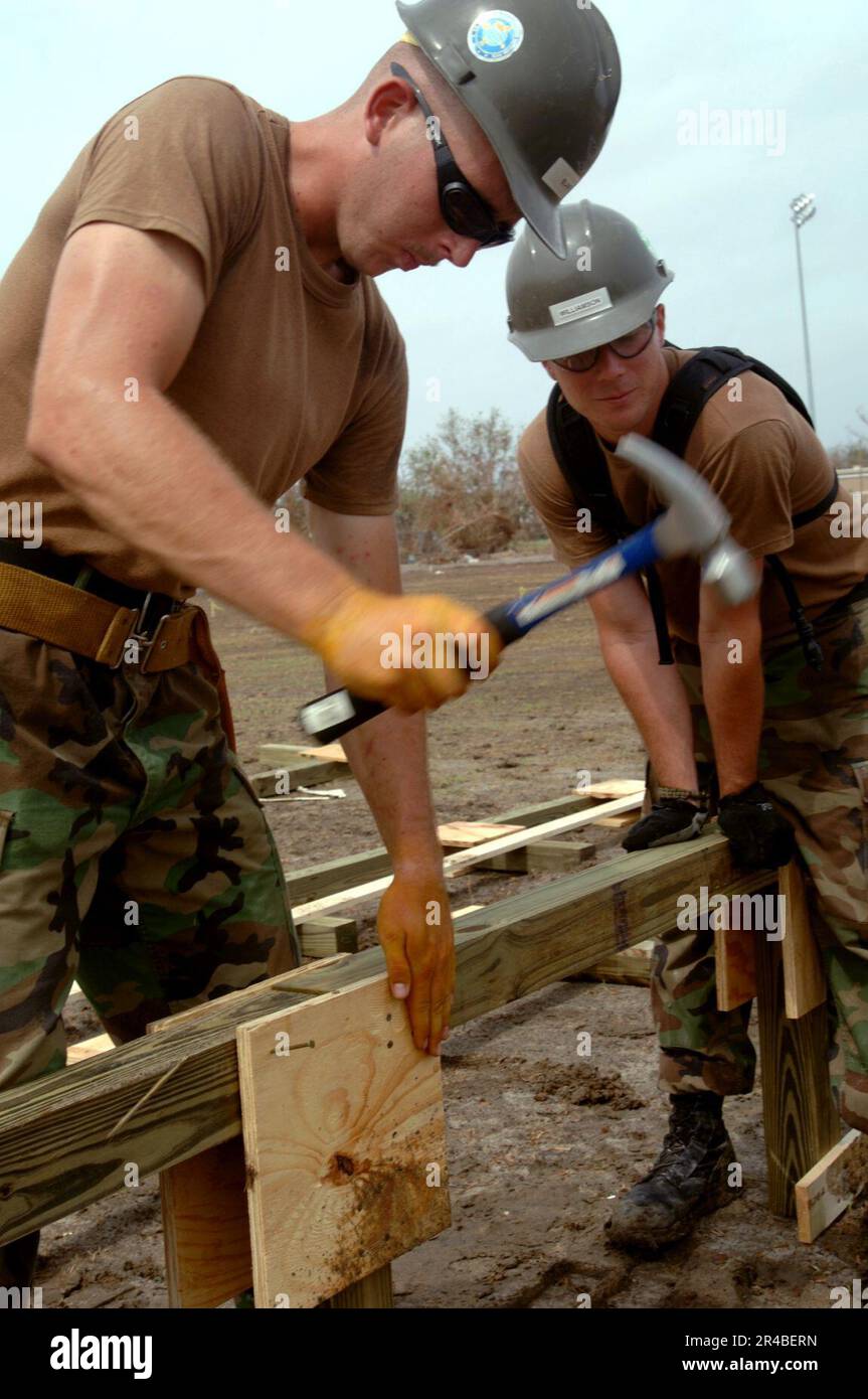 US Navy U.S. Navy Builder 3rd Class assigned to Naval Mobile ...