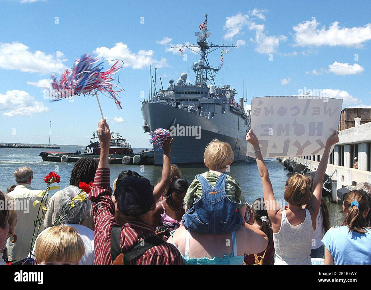 US Navy Friends and family members watch as the amphibious transport ...