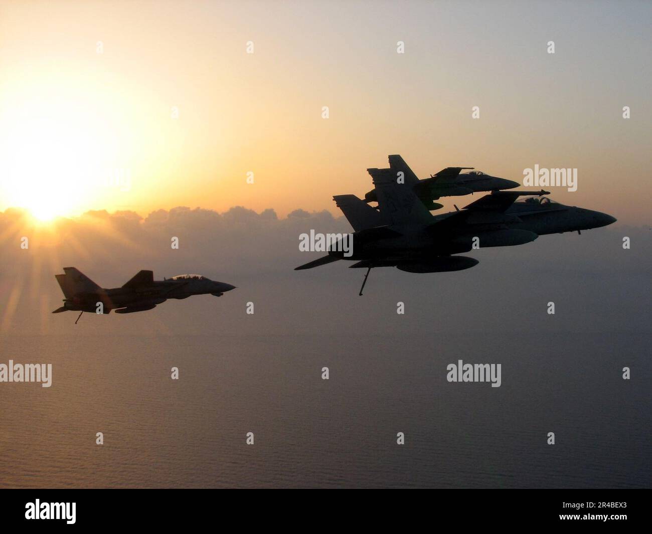 US Navy Two F-A-18C Hornets and an F-14D Tomcat fly in a loose ...