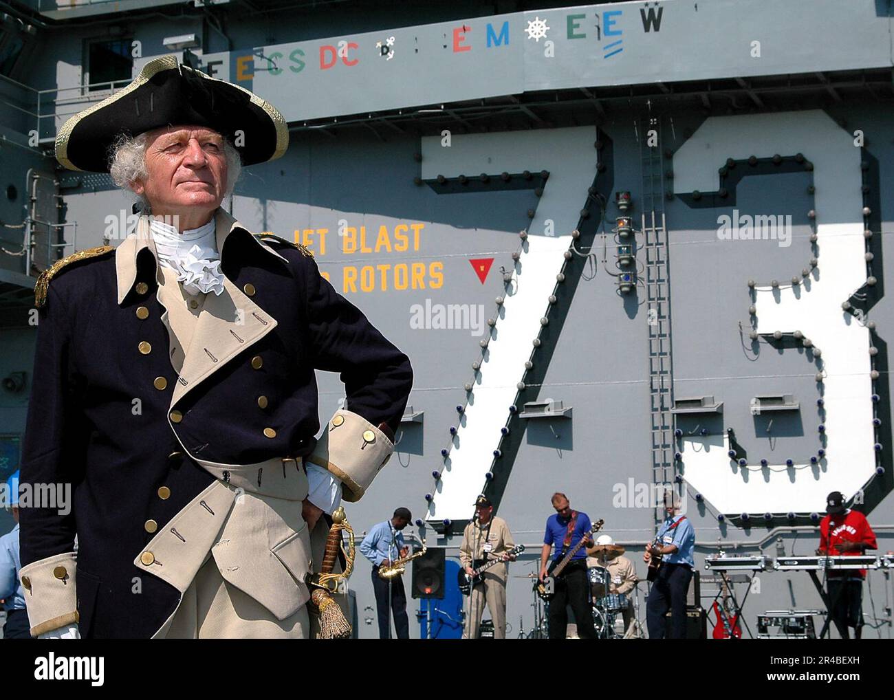 US Navy A General George Washington impersonator, poses in front of the ...