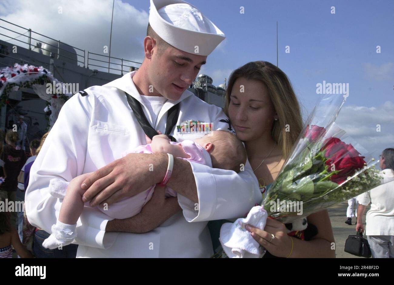 US Navy Damage Controlman holds his new daughter for the first time ...