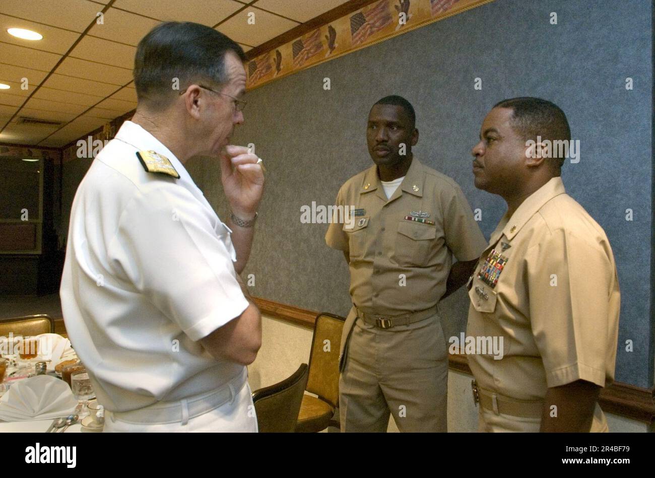 US Navy Chief of Naval Operations (CNO) Adm. Mike Mullen listens to ...