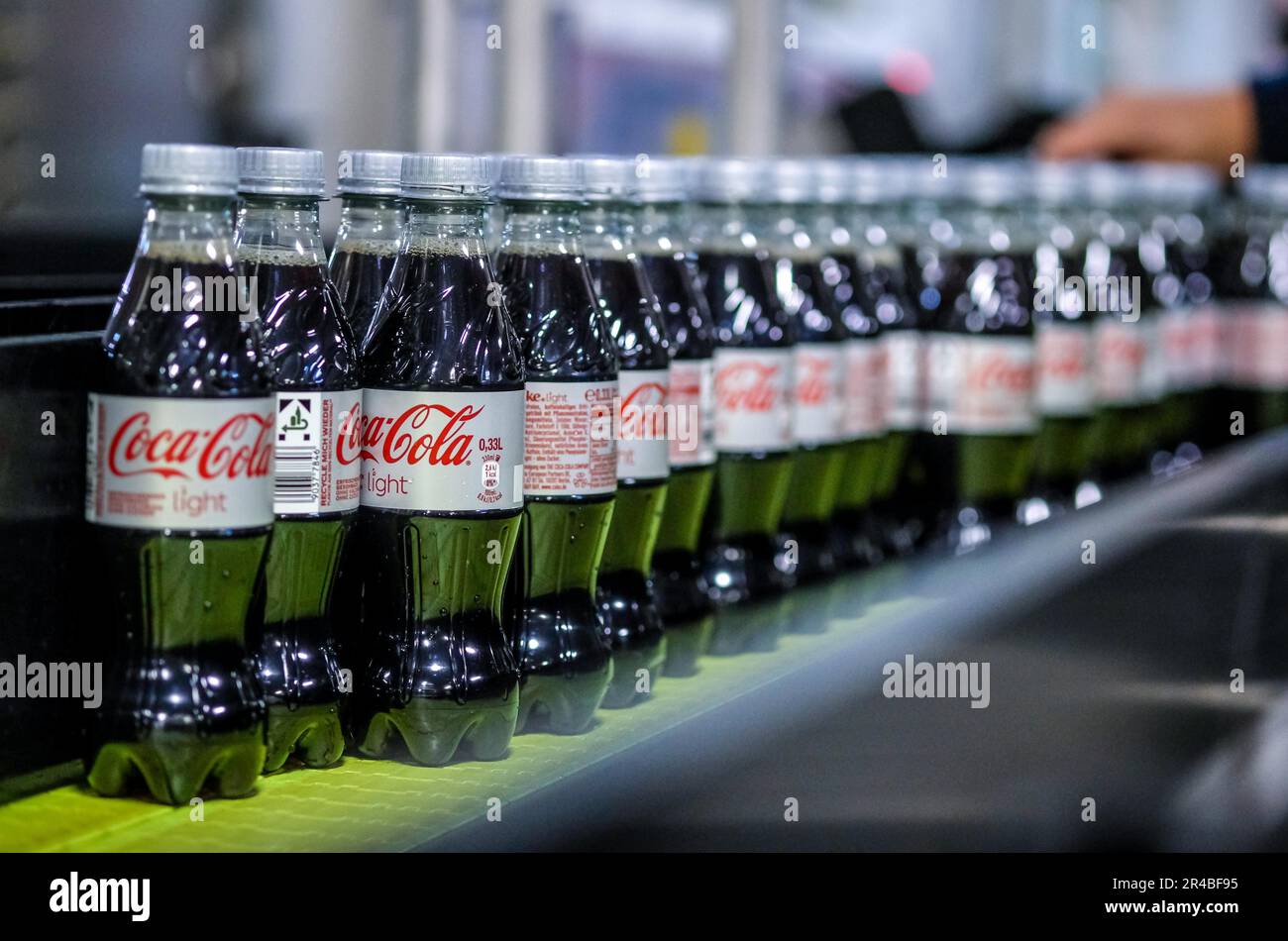 Coca Cola bottles on a conveyor belt of a bottling line Stock Photo - Alamy