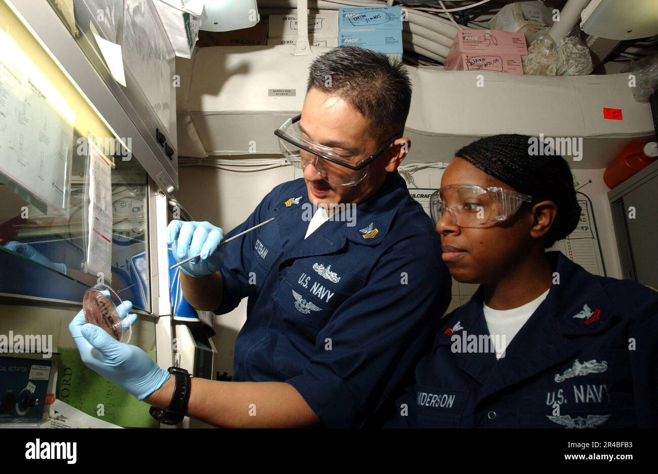 US Navy Hospital Corpsman 1st Class explains to Hospital Corpsman 2nd ...