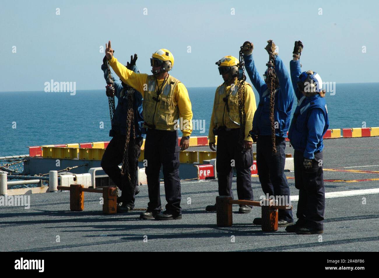 US Navy Aviation Boatswain's Mates display all chocks and chains for ...