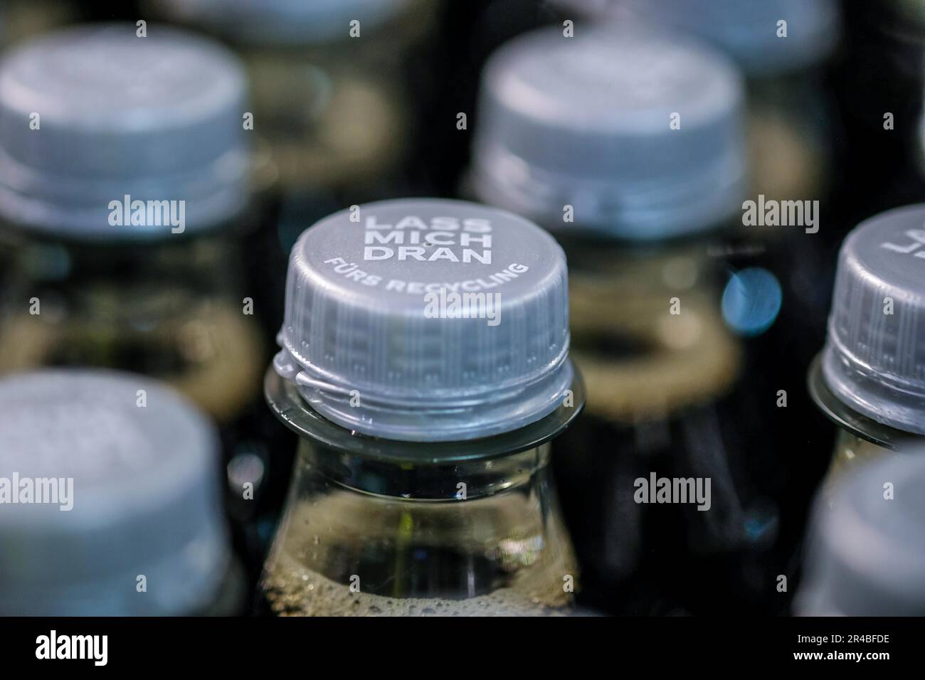 New bottle cap on a Coca-Cola bottle. New EU directive. The cap must ...