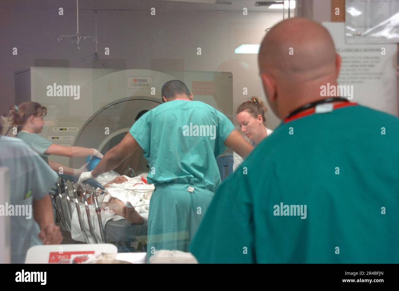 US Navy U.S. Navy Ens. right, a physician's assistant observes corpsmen ...