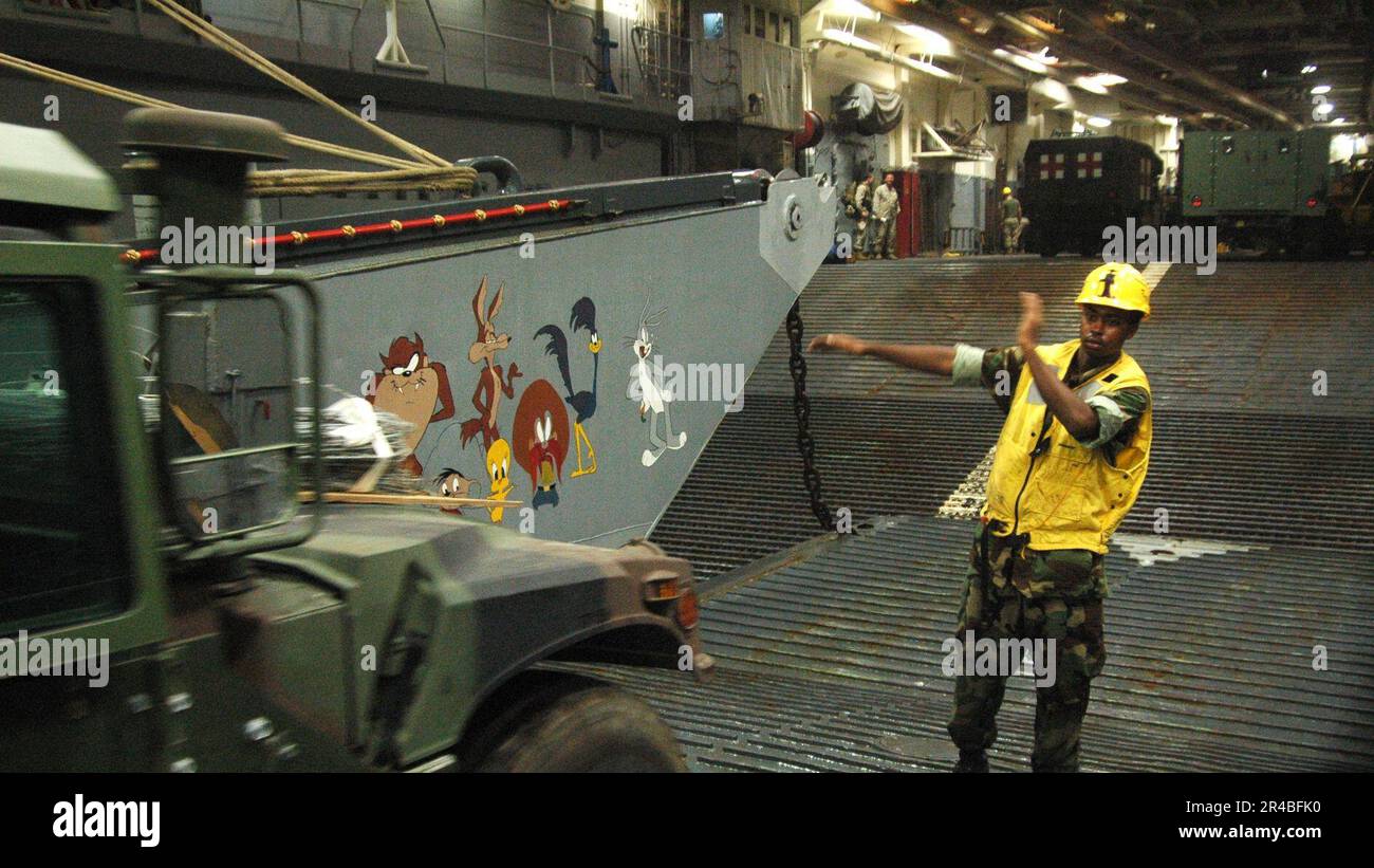 US Navy Boatswain's Mate 3rd Class assigned to a Landing Craft, Utility ...