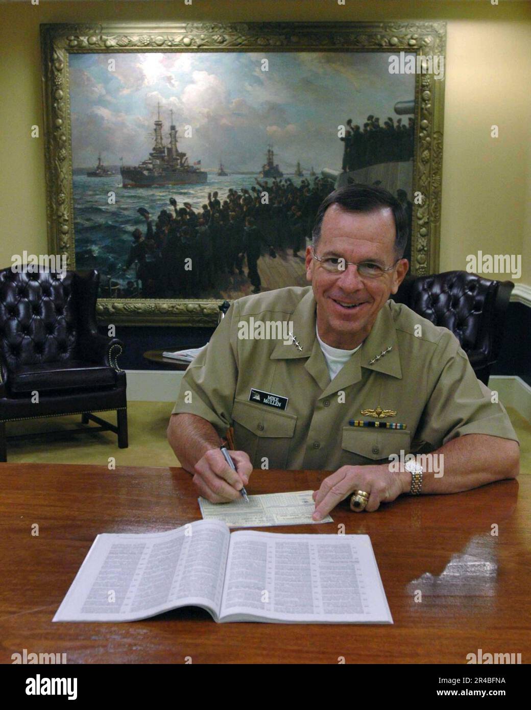 US Navy Chief of Naval Operations (CNO) Adm. Mike Mullen, signs his ...