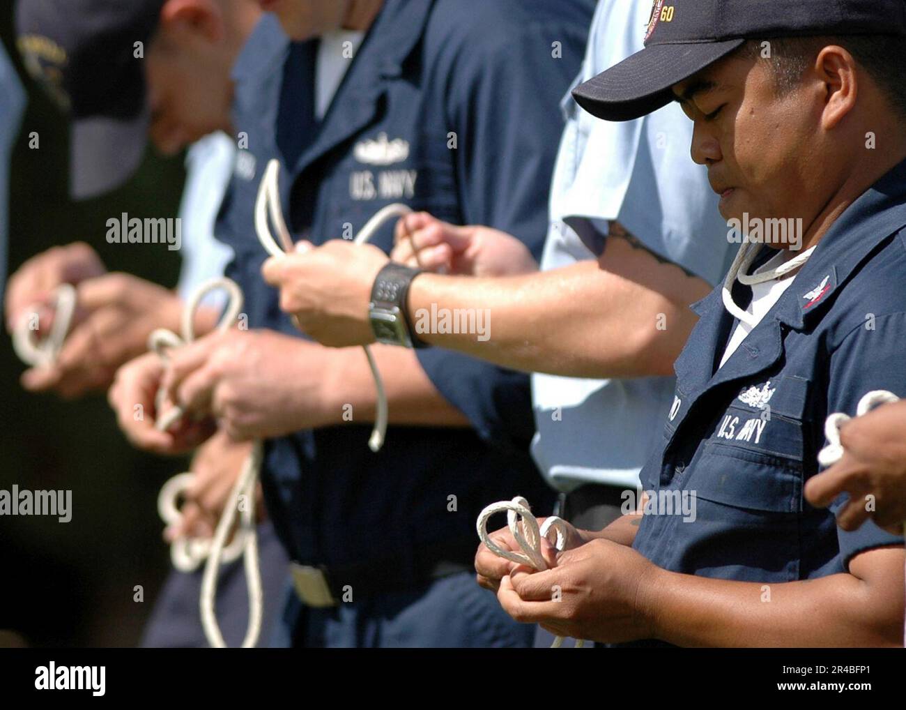 US Navy A Sailor assigned to the guided missile destroyer USS Paul ...