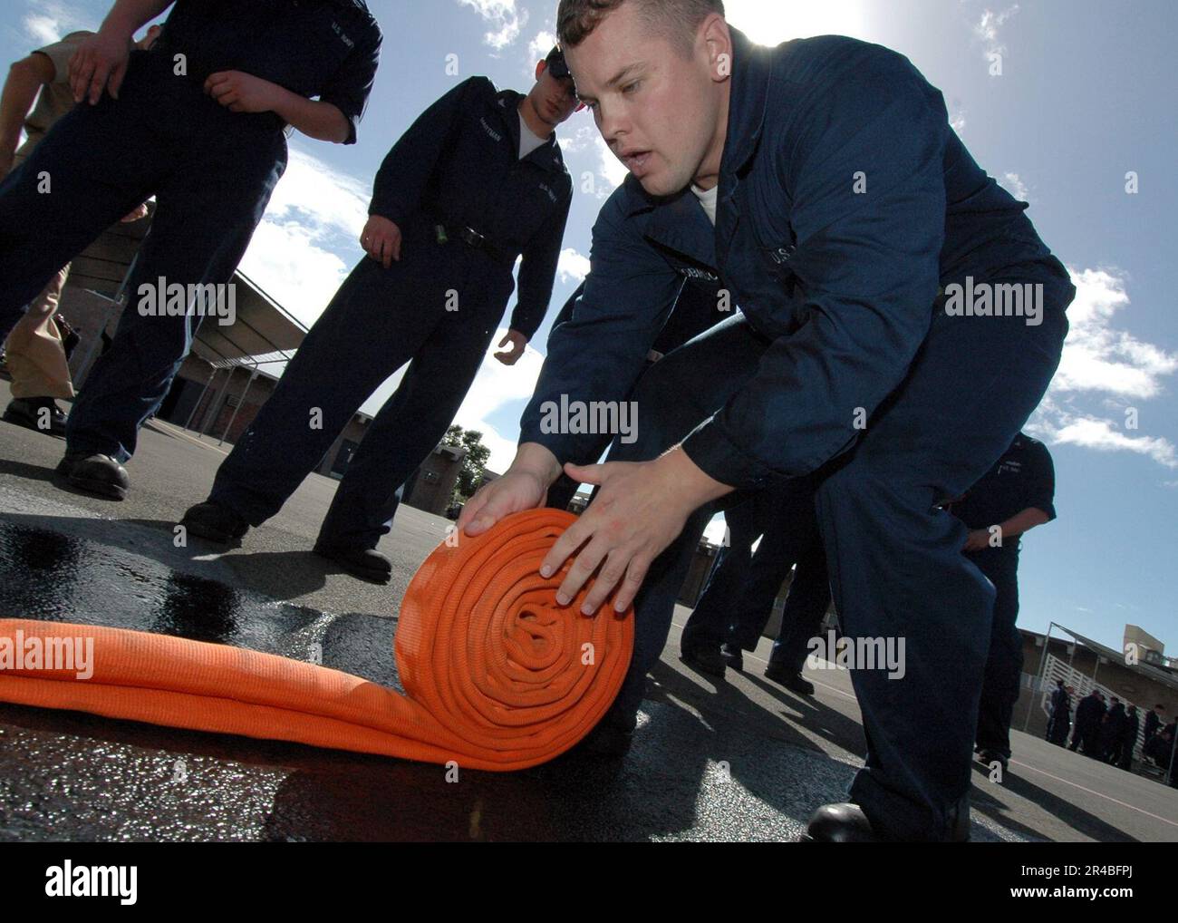 US Navy Damage Controlman Fireman assigned to the guided missile ...