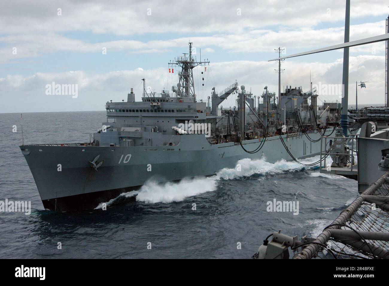 US Navy The Military Sealift Command (MSC) fast combat support ship USNS Bridge (T-AOE 10) pulls ...