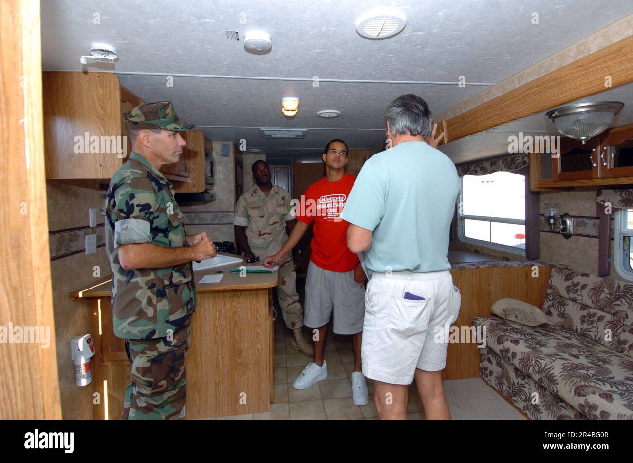 US Navy U.S. Navy Seabee, Yeoman 3rd Class center, assigned to Naval ...