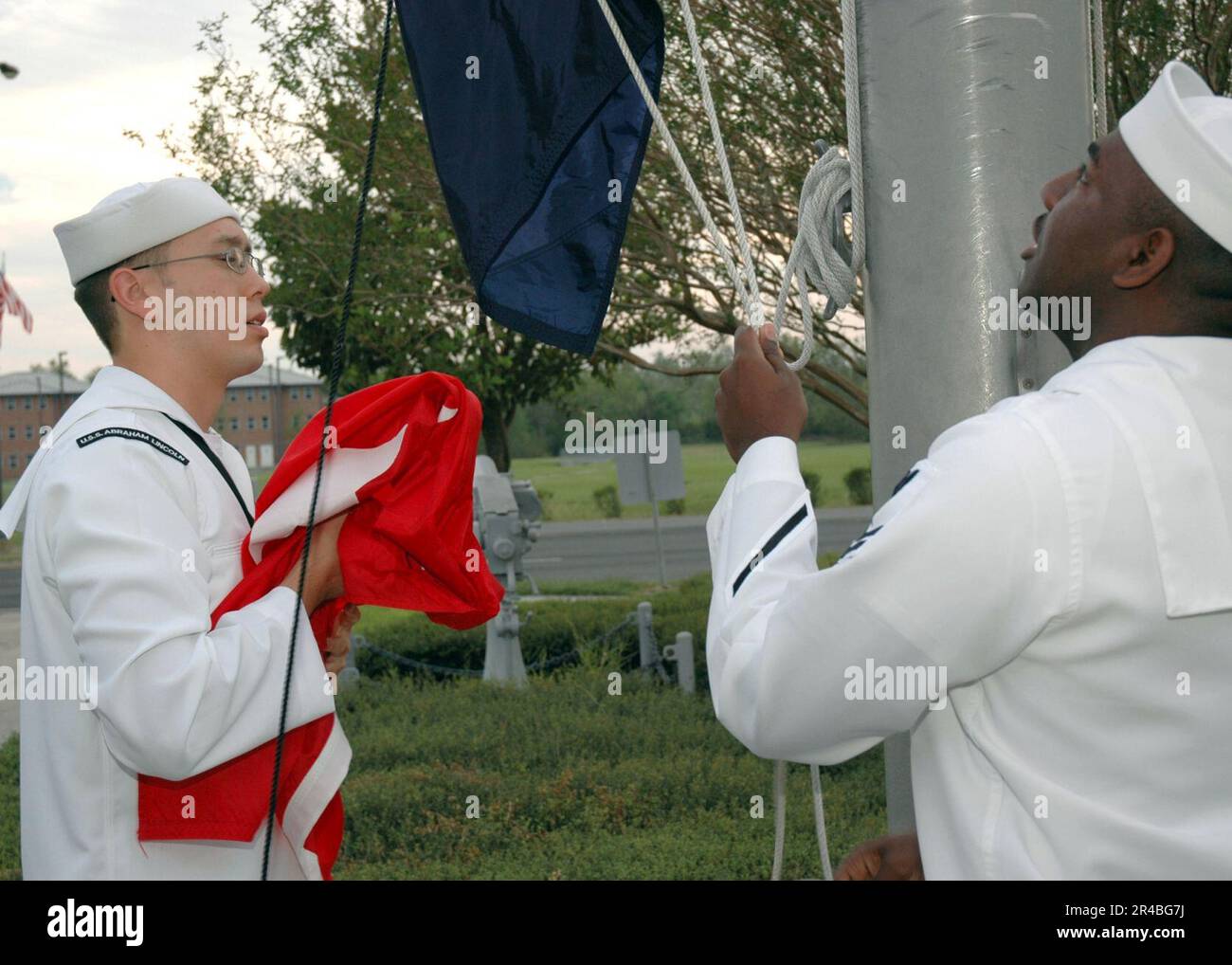 US Navy Air Traffic Controller 2nd Class and Yeoman 2nd Class raise the ...