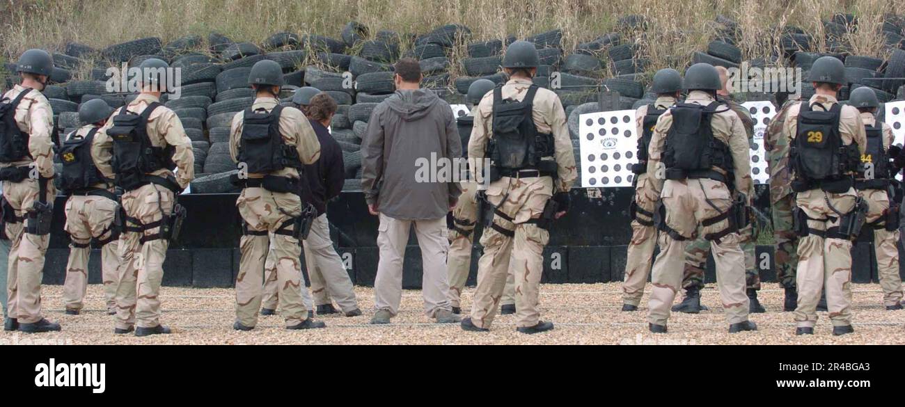 US Navy Sailors from various commands qualify on the 9mm pistol during ...