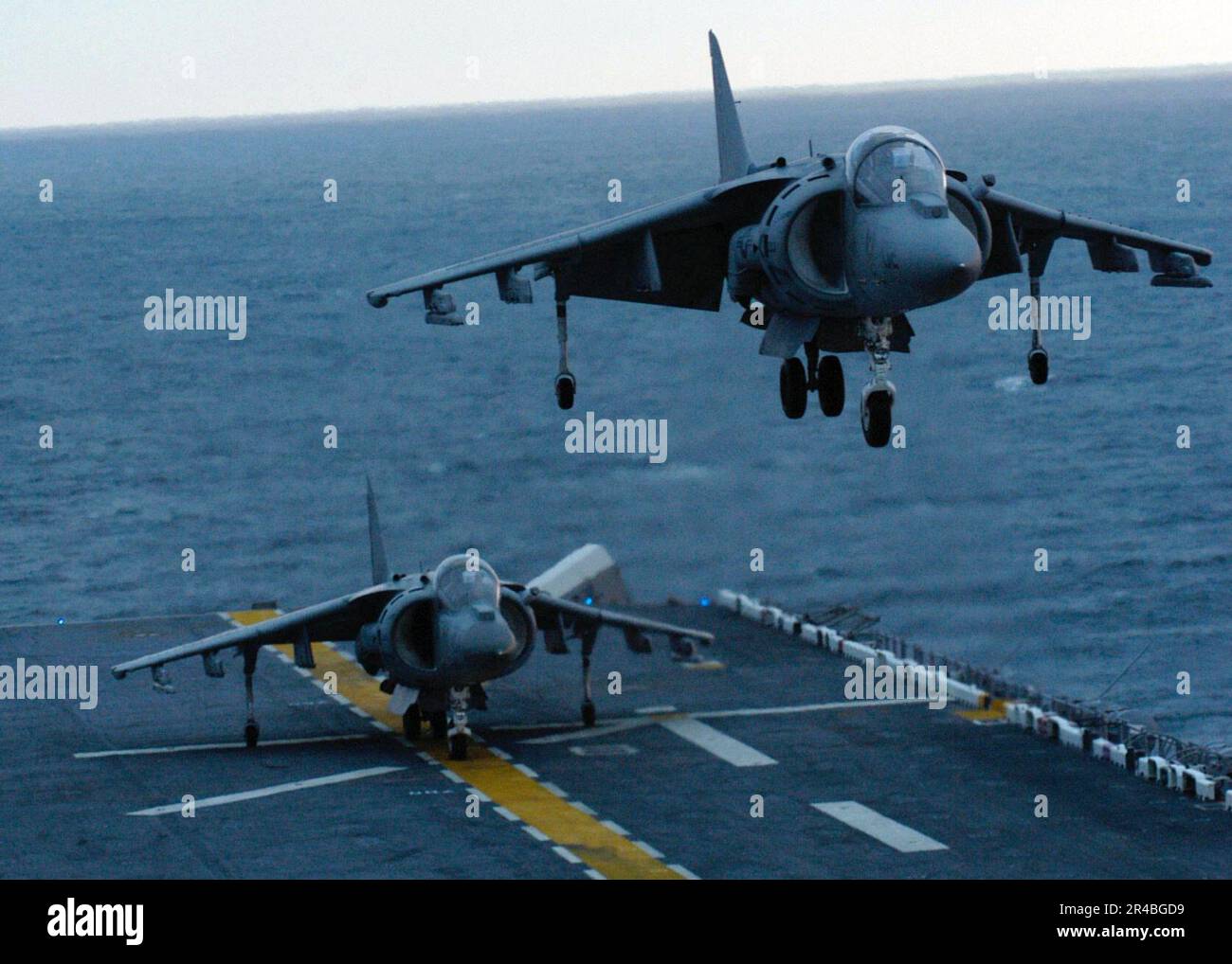 US Navy A U.S. Marine Corps AV-8B Harrier prepares to land vertically ...