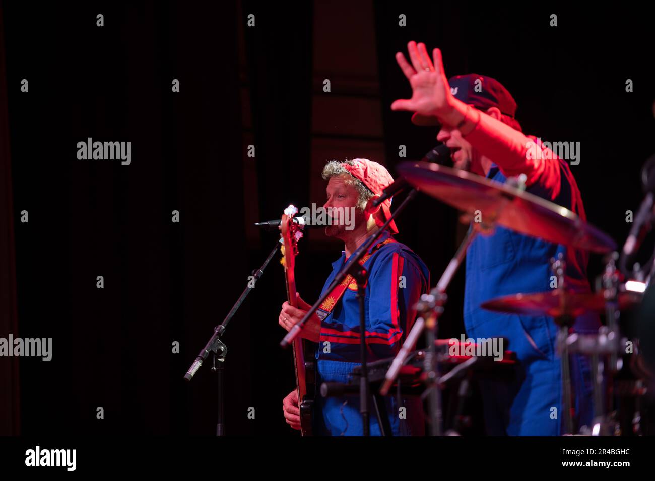 Imagination Mover Dave Poche plays lead guitar during a children's song ...