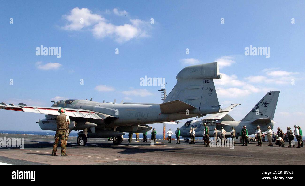 US Navy Air Department and squadron personnel line up between bow ...