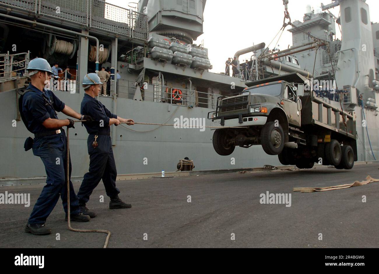 US Navy Personnel assigned to the dock landing ship USS Pearl Harbor ...