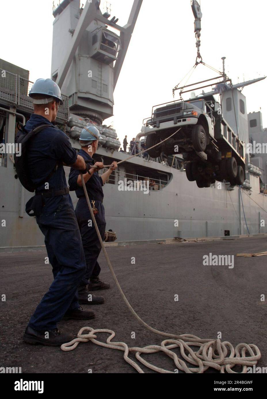 US Navy Personnel assigned to the dock landing ship USS Pearl Harbor ...
