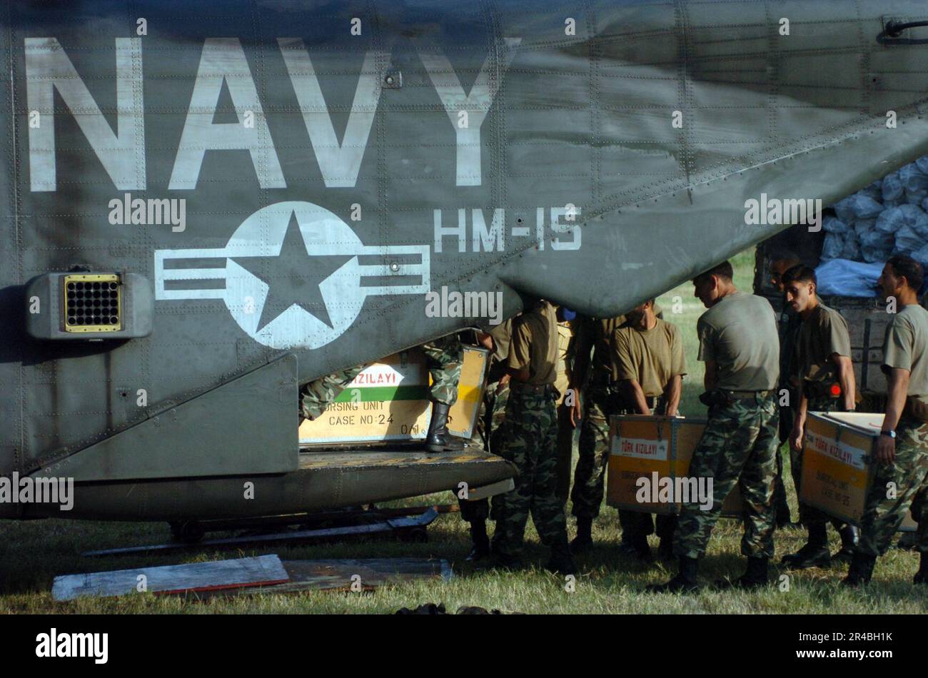 US Navy Pakistani soldiers load medical supplies onto a U.S. Navy MH ...
